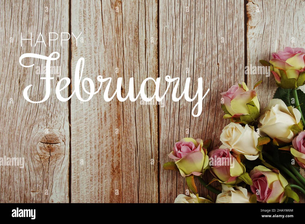 Welcome February typography text with rose flowers bouquet on wooden ...