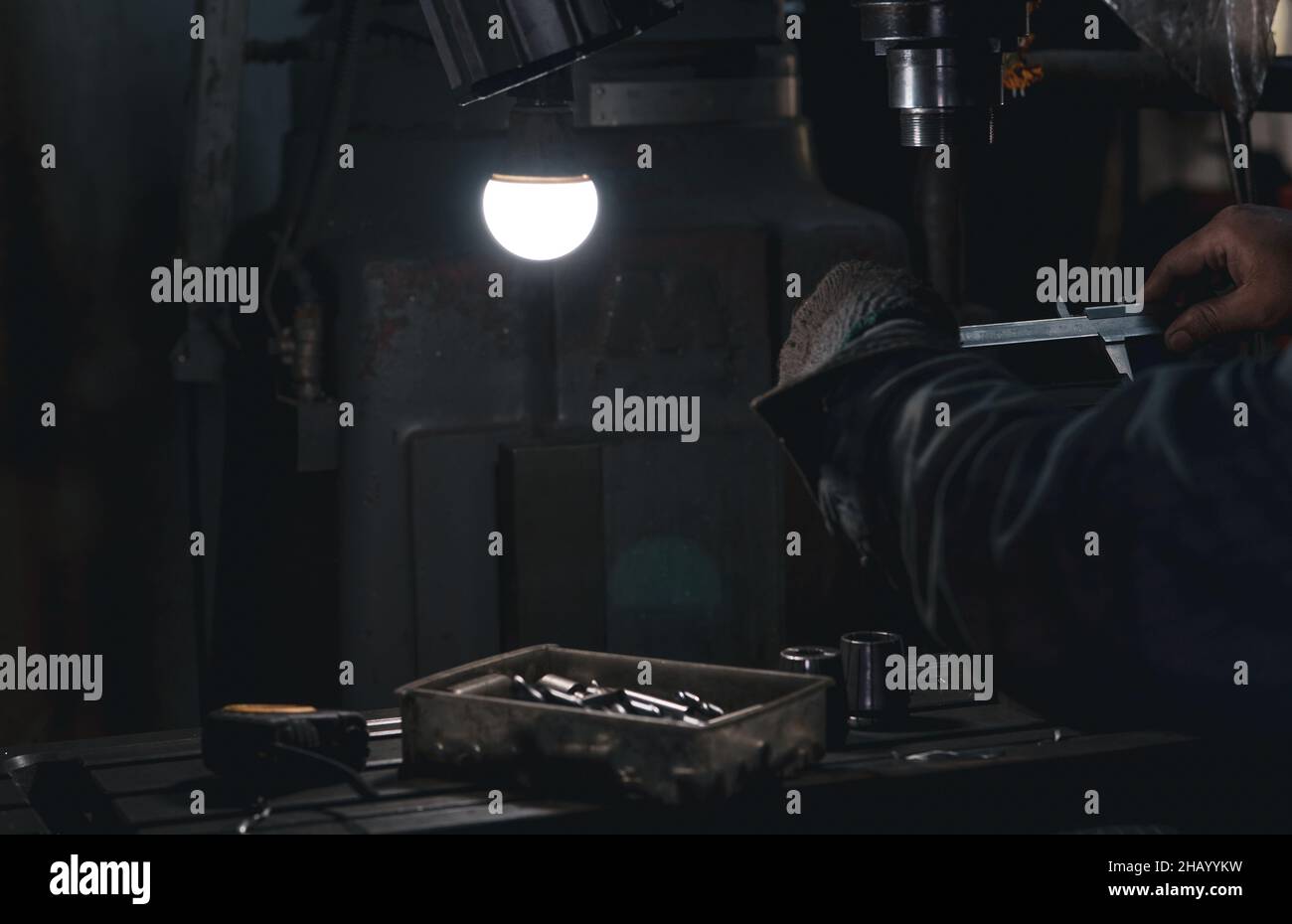 Technician measure workpice at milling machine. Tool for cut metal ...