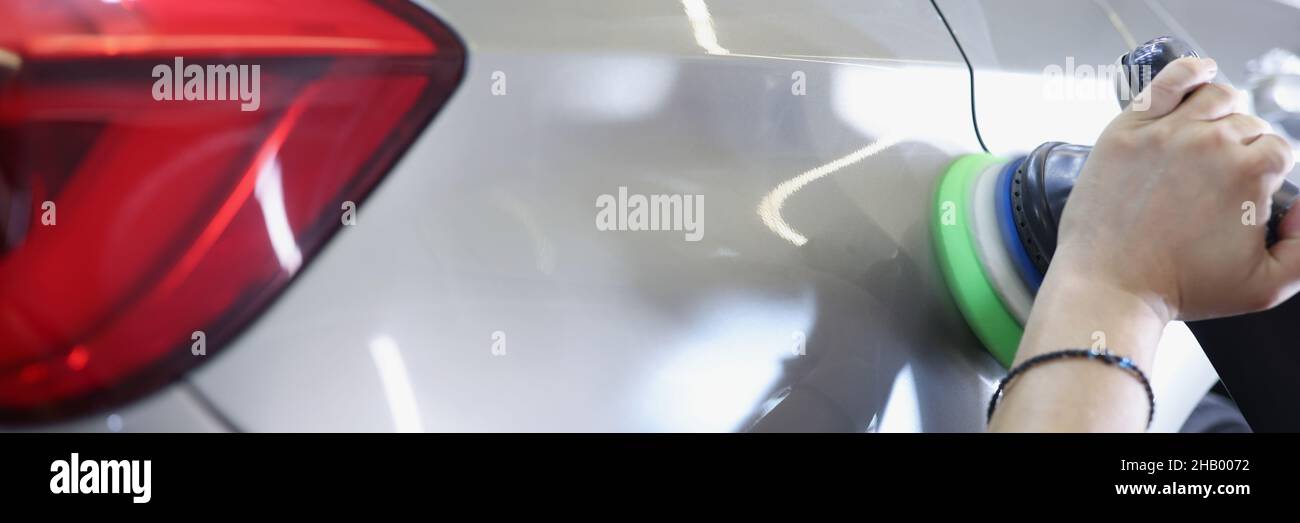 Master polishing car using special machine closeup Stock Photo - Alamy