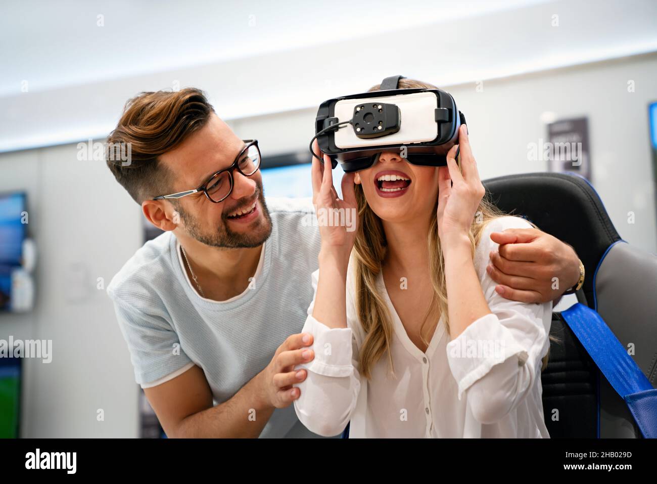 Portrait of happy people having fun with virtual reality glasses ...