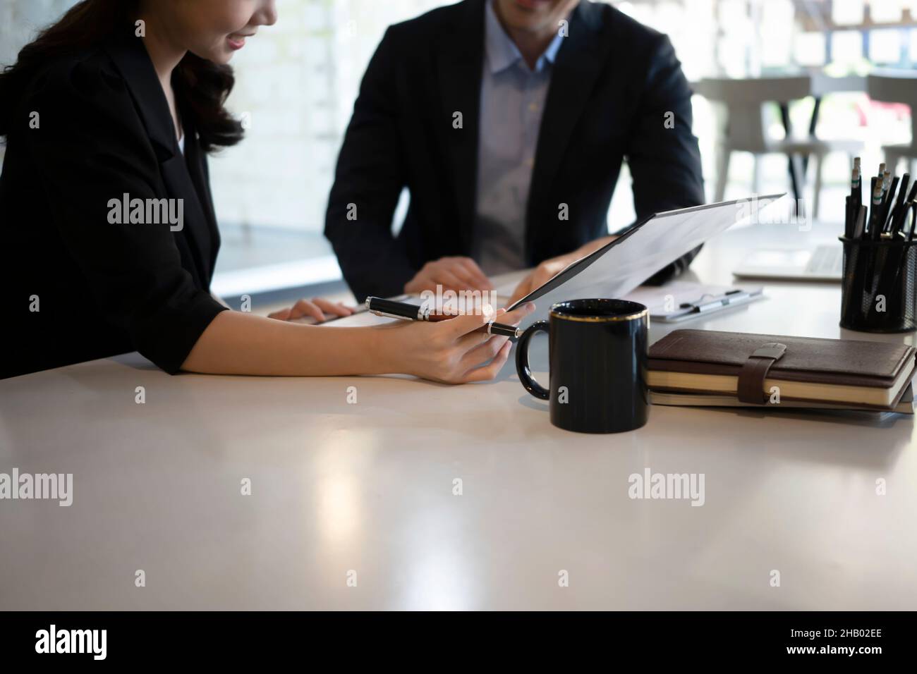 Team manager checking coworkers project hi-res stock photography and ...