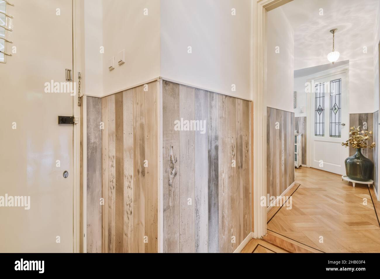 Delightful corridor design with wood skirting and chic parquet flooring ...