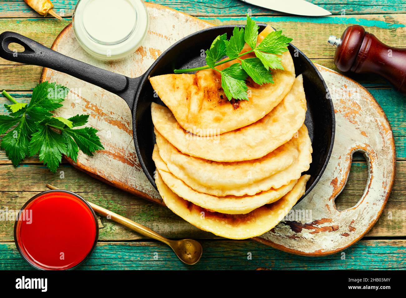 Chebureks, fried crescent-shaped cakes with meat filling Stock Photo ...