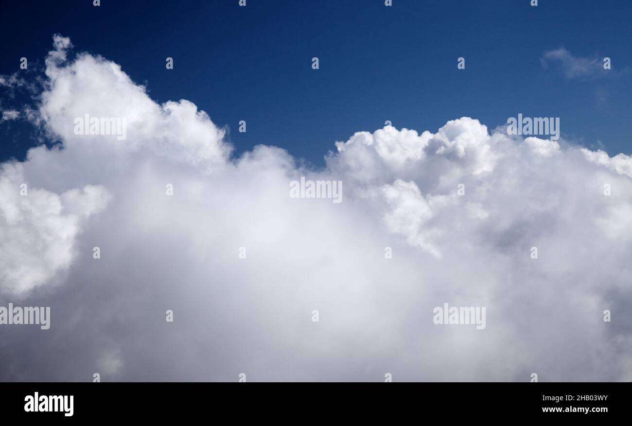 Natural background of sky with a band of cumulus clouds Stock Photo - Alamy