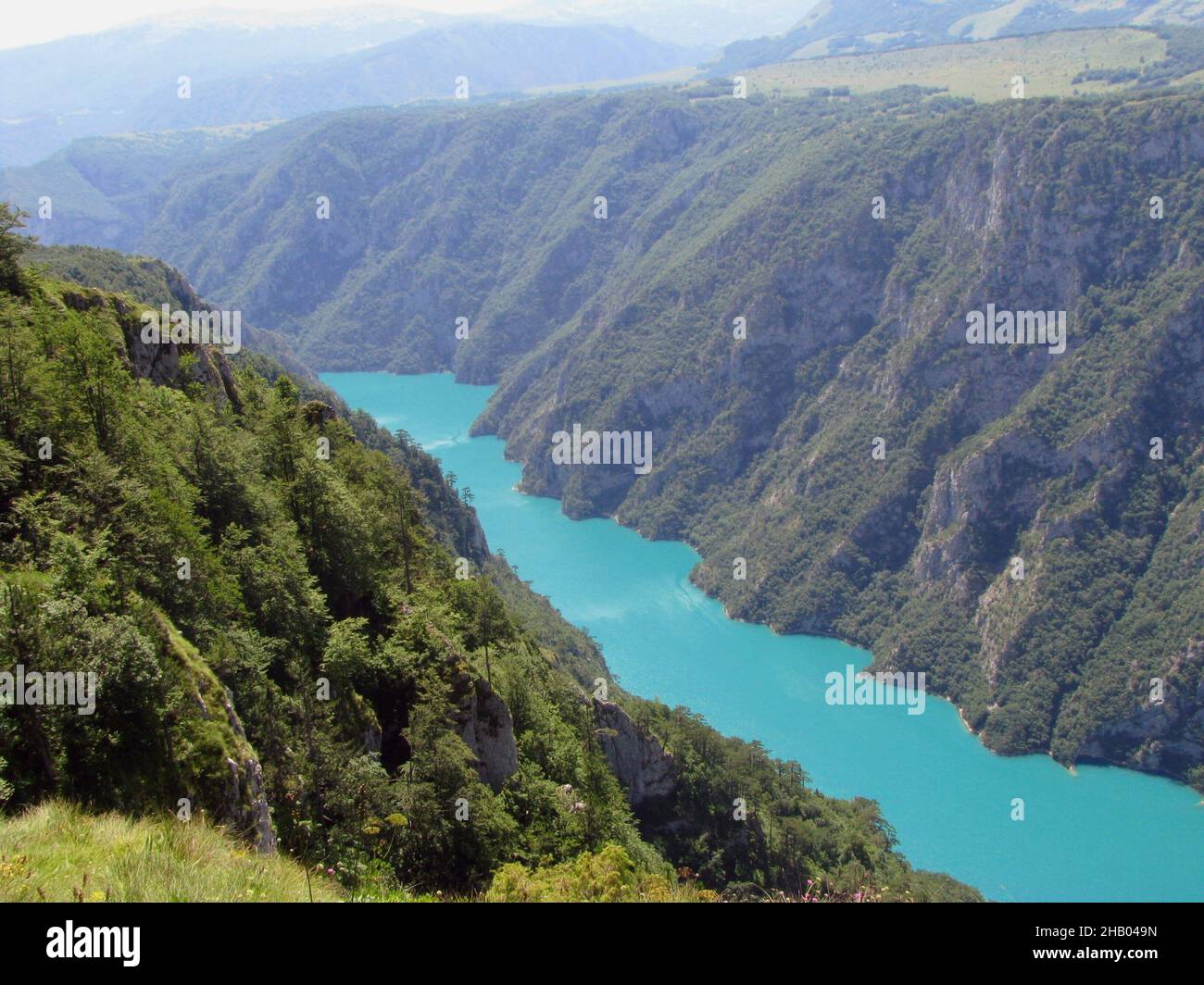 Glorious landscape of an azure river flowing through the mountains ...