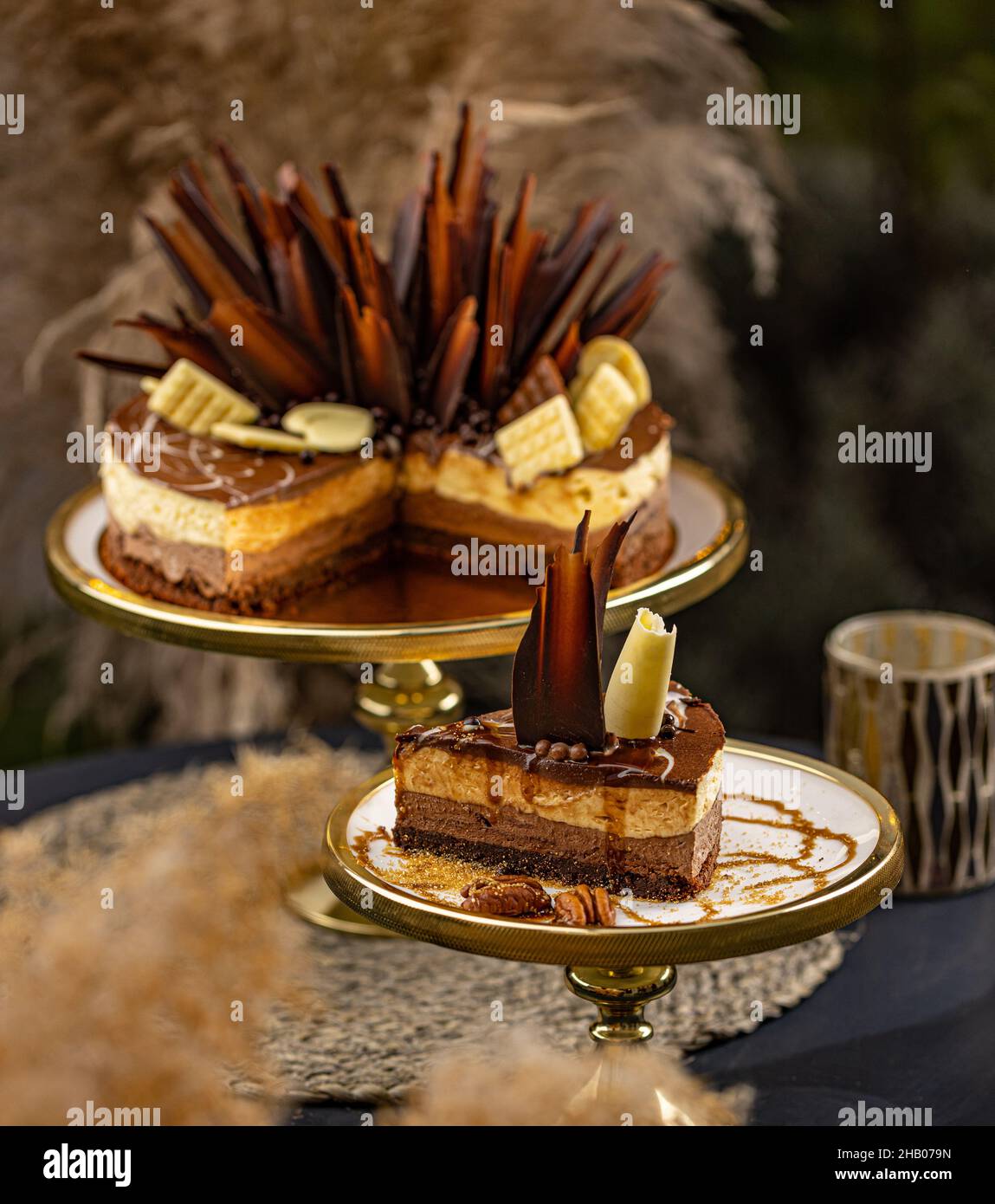 Layered chocolate cake decorated with fancy chocolate flakes Stock ...
