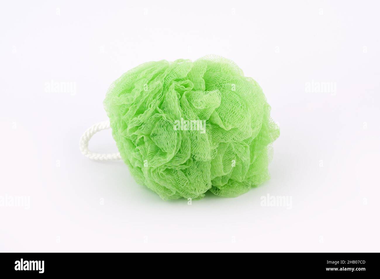 Soft green bath puff or sponge isolated on white background. Studio ...