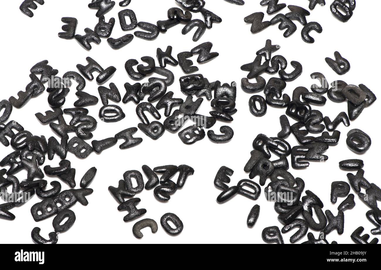 seemingly random scattered black letters isolated on white background ...