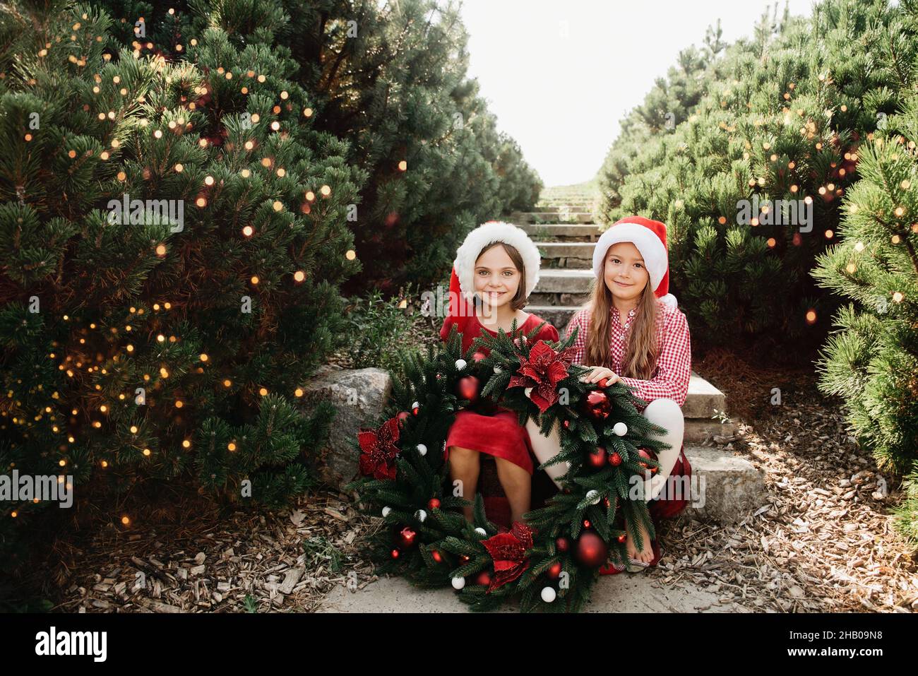 Merry Christmas. Portrait of two happy funny children girls in Santa ...