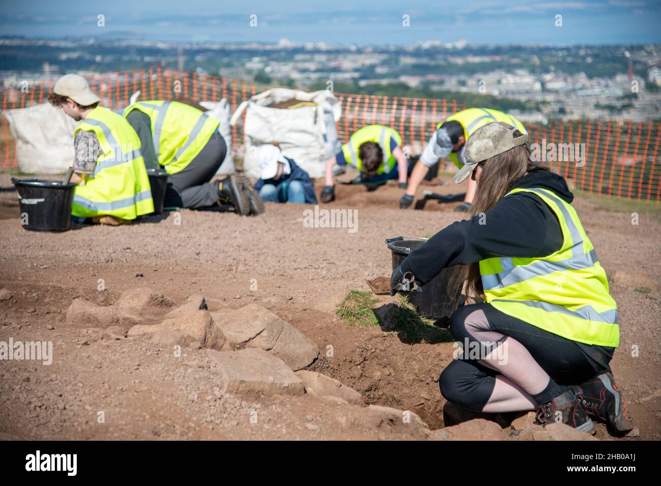 Archaeologists digging at an excavation site at Arthur's Seat ...
