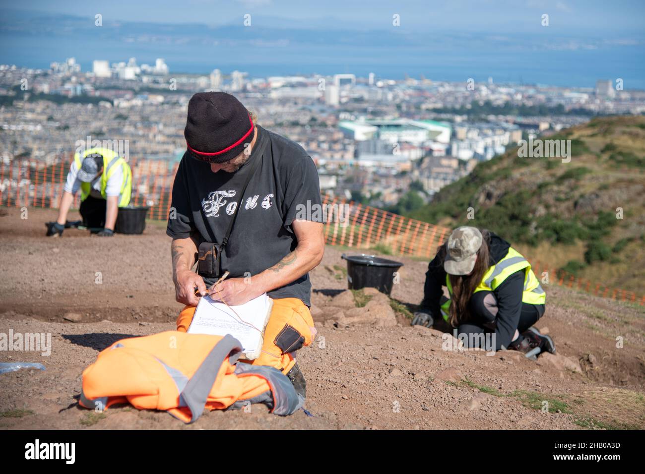 Archaeologists digging at an excavation site at Arthur's Seat ...