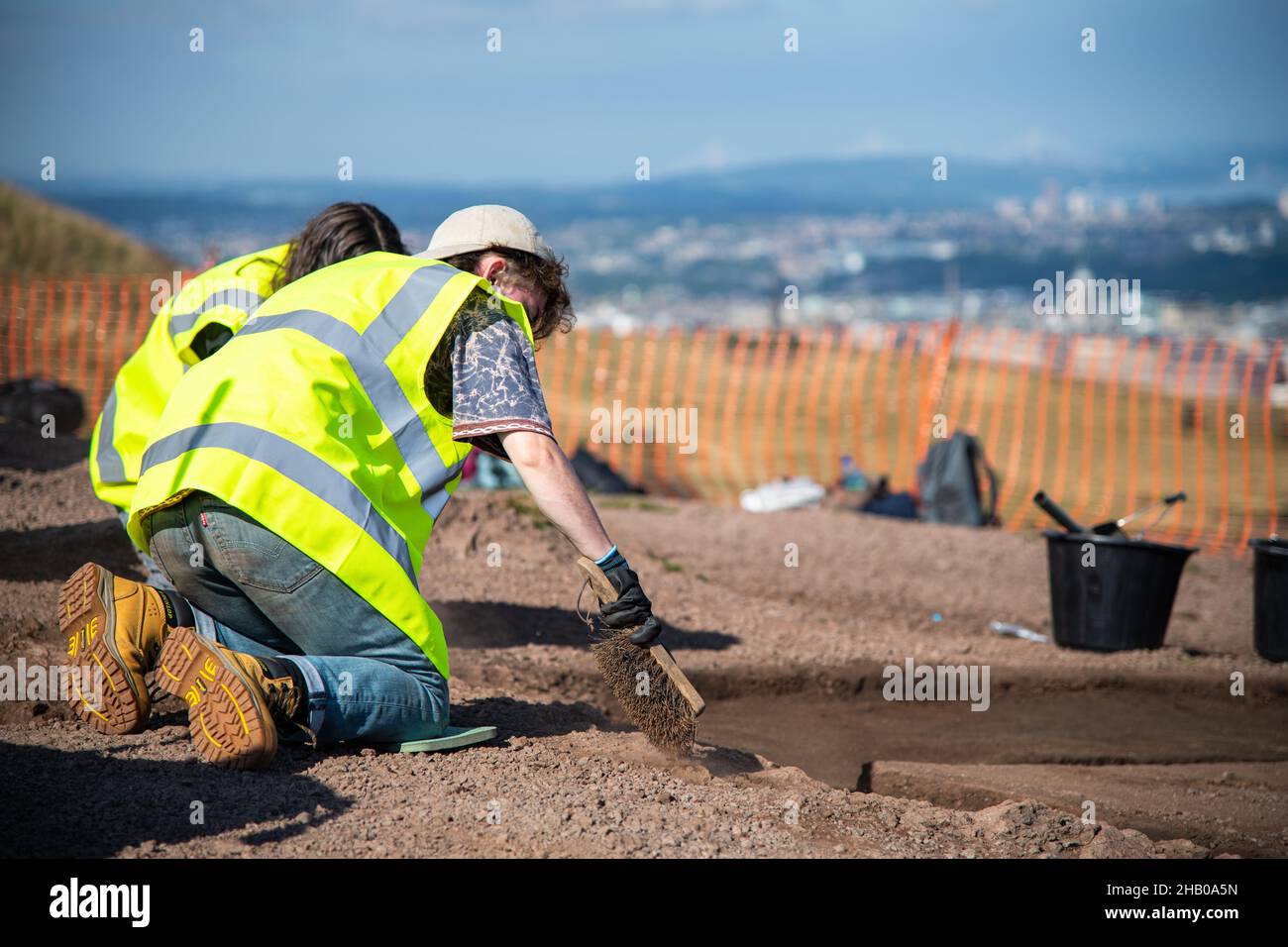 Archaeologists digging at an excavation site at Arthur's Seat ...