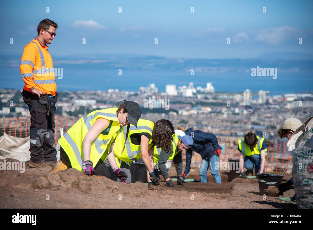Archaeologists digging at an excavation site at Arthur's Seat ...