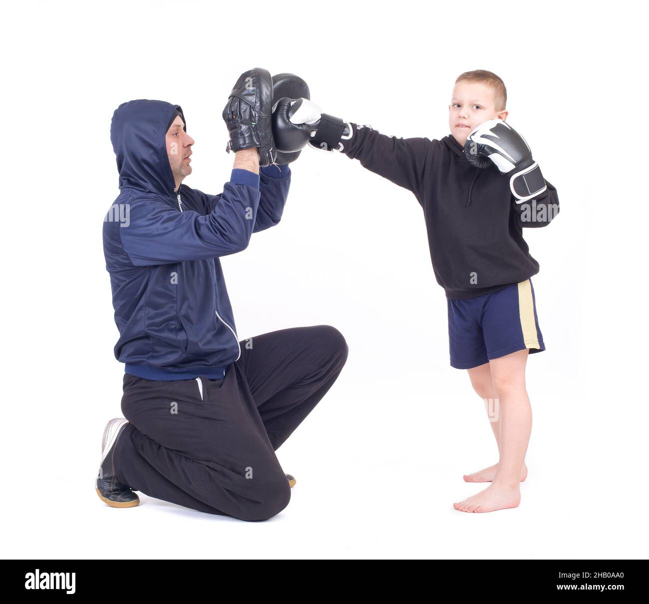 Kickboxing kids with instructor. Isolated on a white background. Studio ...