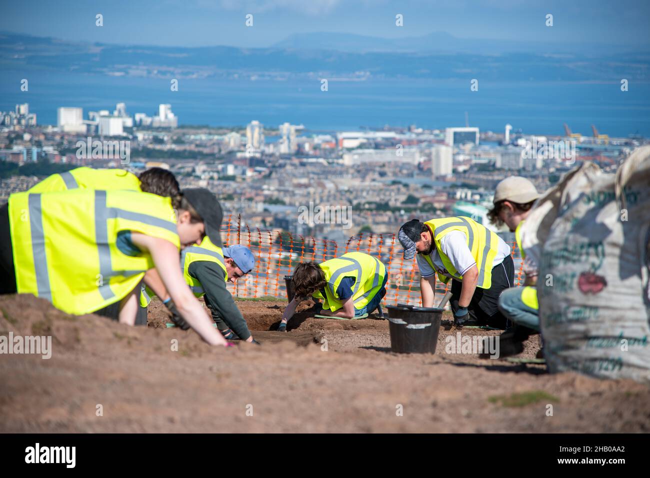 Archaeologists digging at an excavation site at Arthur's Seat ...