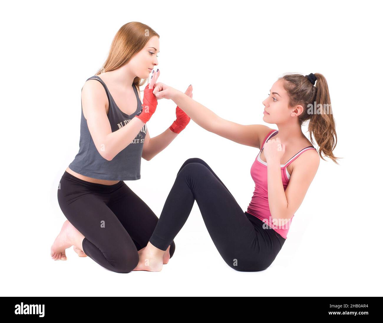 Kickboxing girl exercise in studio. Isolated on a white background ...