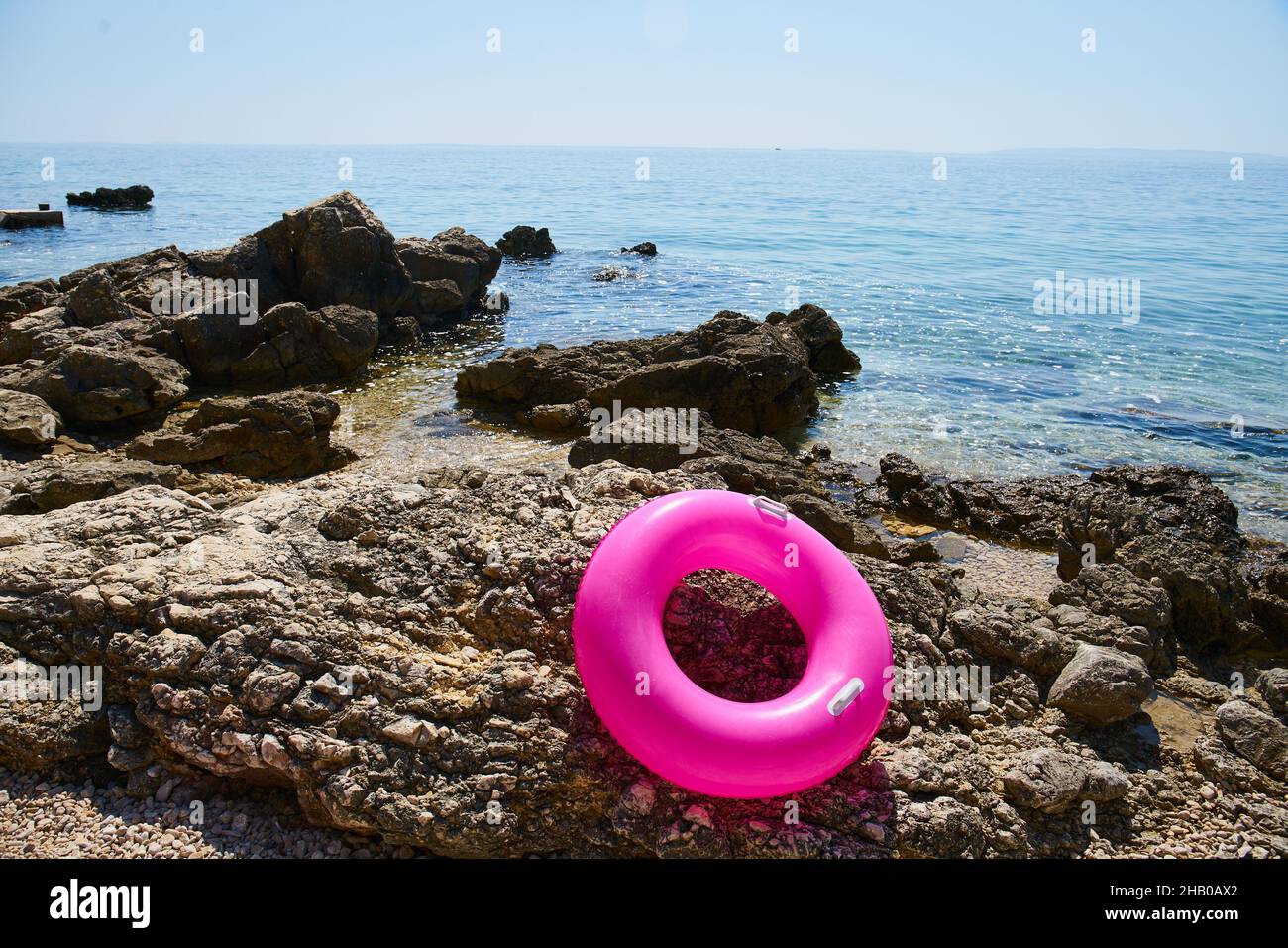 colorful floaters on sea coast beach Stock Photo - Alamy