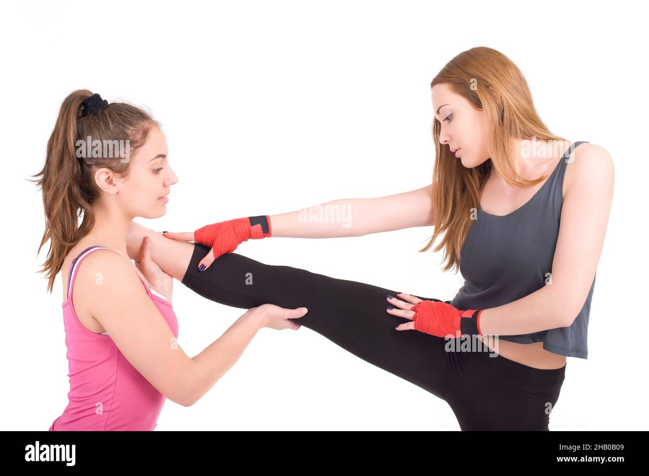Kickboxing girl exercise in studio. Isolated on a white background ...