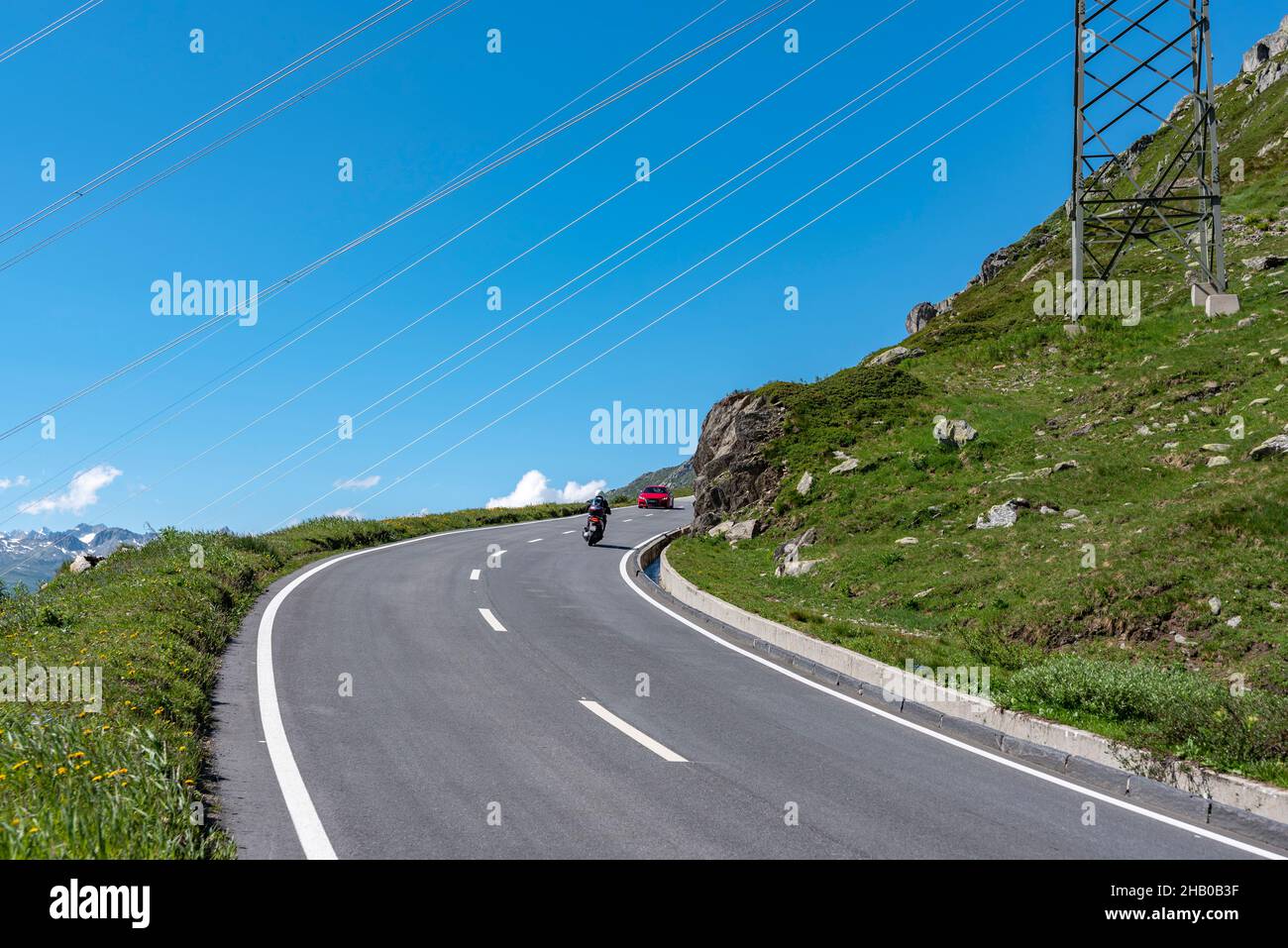 Power lines cross the Nufenenpass road, Ulrichen, Valais, Switzerland ...