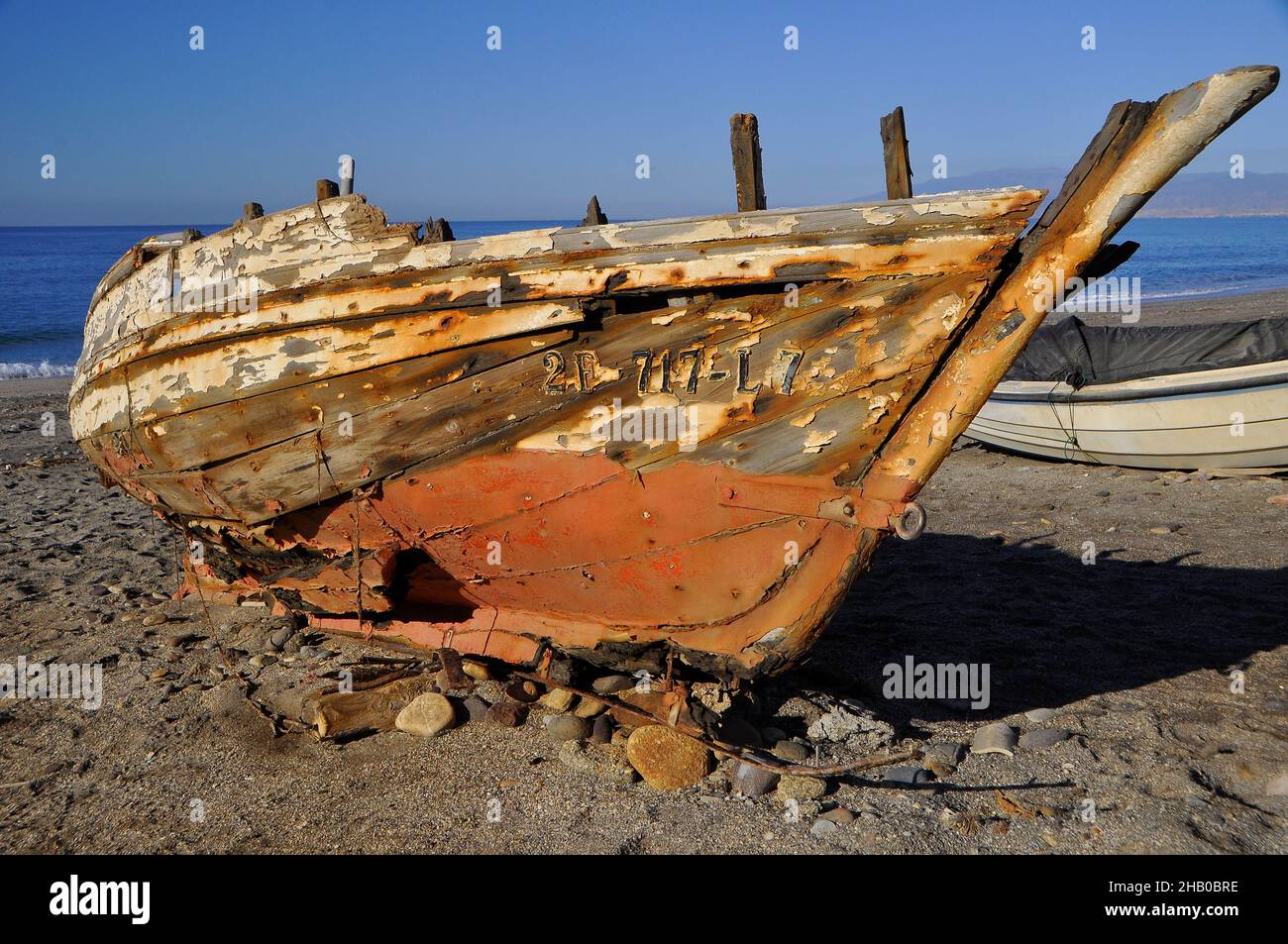 Rotten fishing boat on beach Spain Stock Photo - Alamy