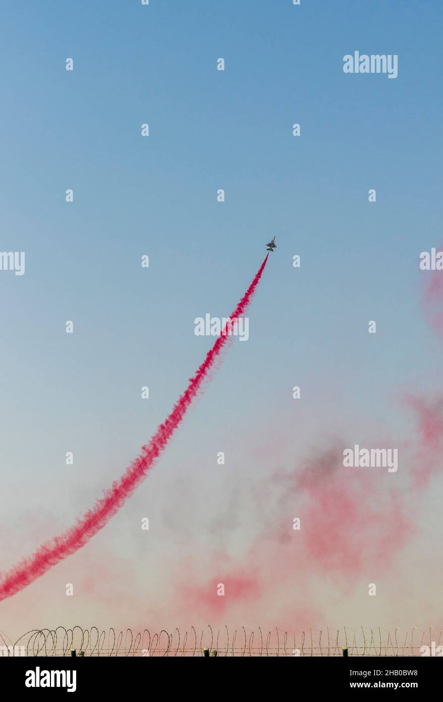 Military airplane performing stunts in clear blue sky Stock Photo - Alamy