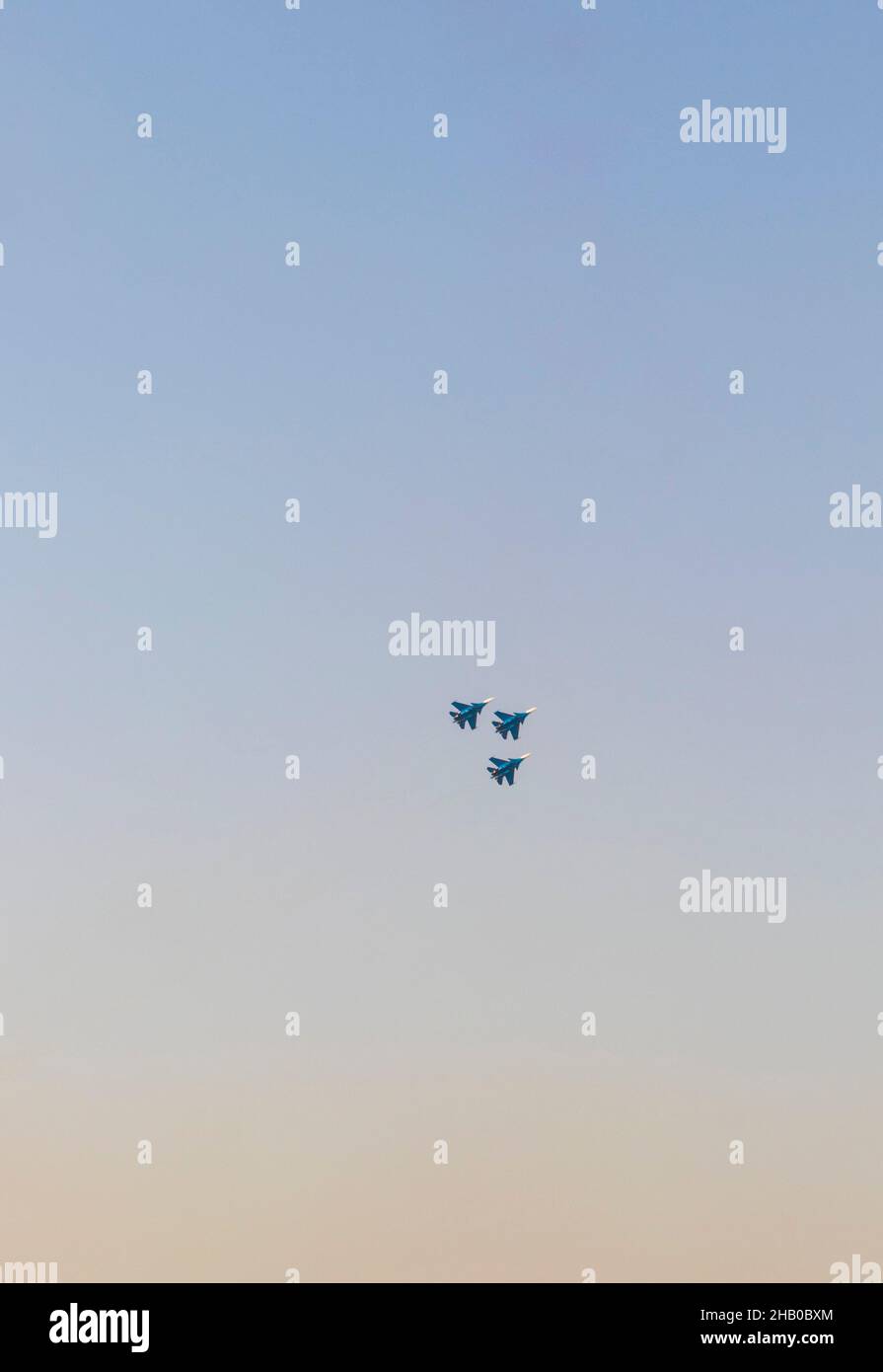 Military airplanes performing stunts in clear blue sky Stock Photo - Alamy