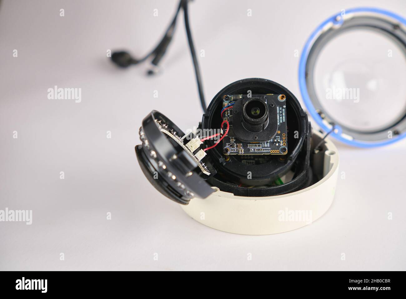 disassembled IP video surveillance camera on white background, isolated ...