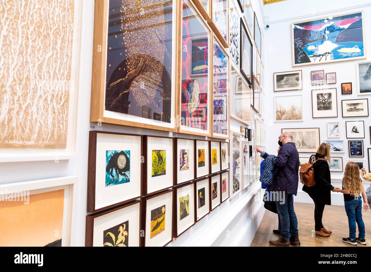 Visitors looking at art at the RA Summer Exhibition 2021, London, UK ...