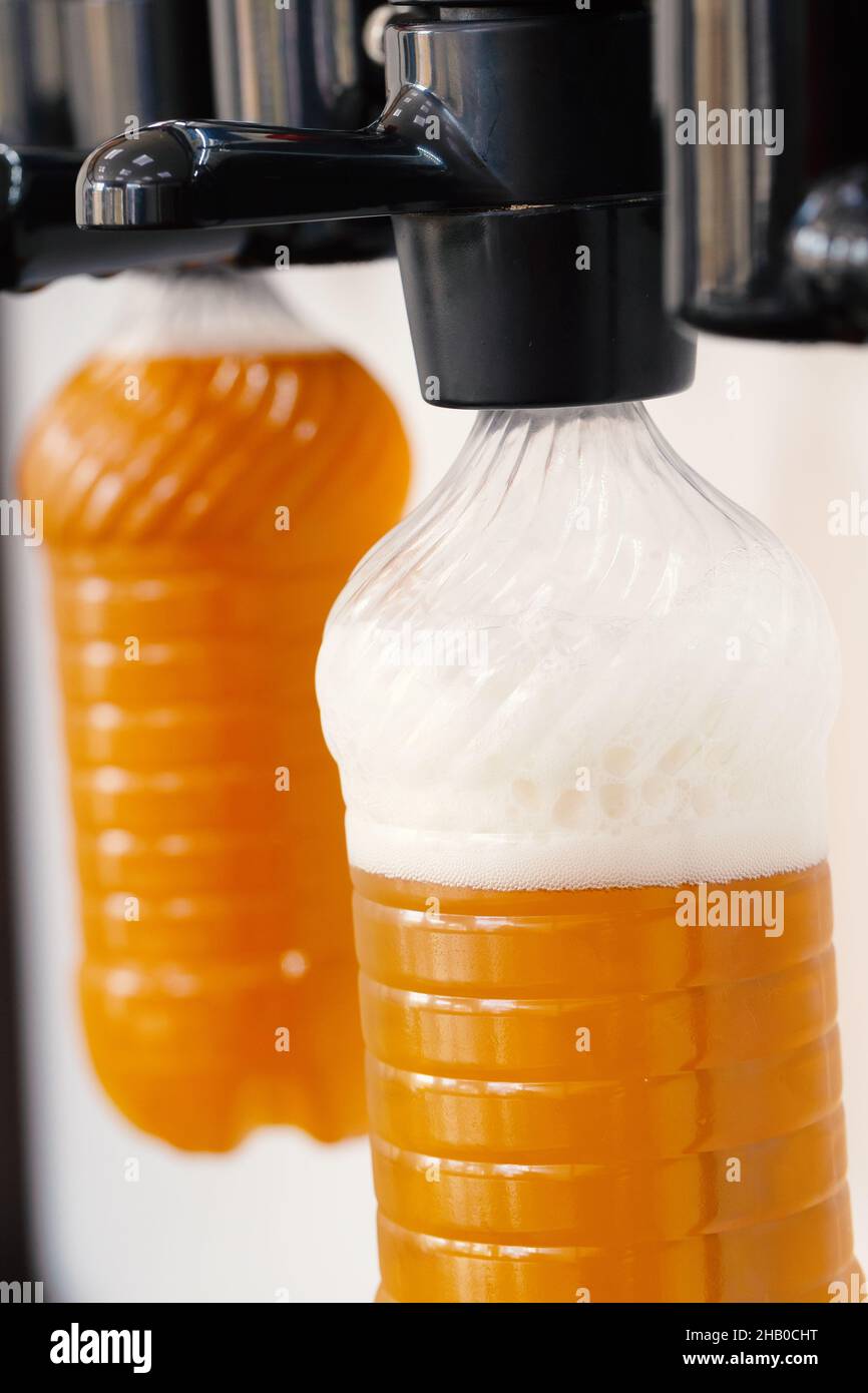 New modern beer taps with plastic bottles on bar counter in pub Stock ...
