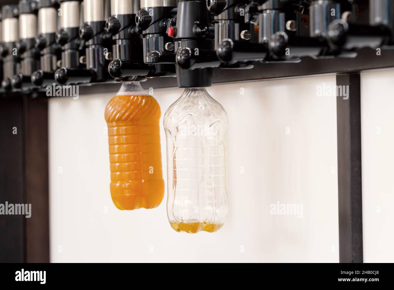 New modern beer taps with plastic bottles on bar counter in pub Stock ...