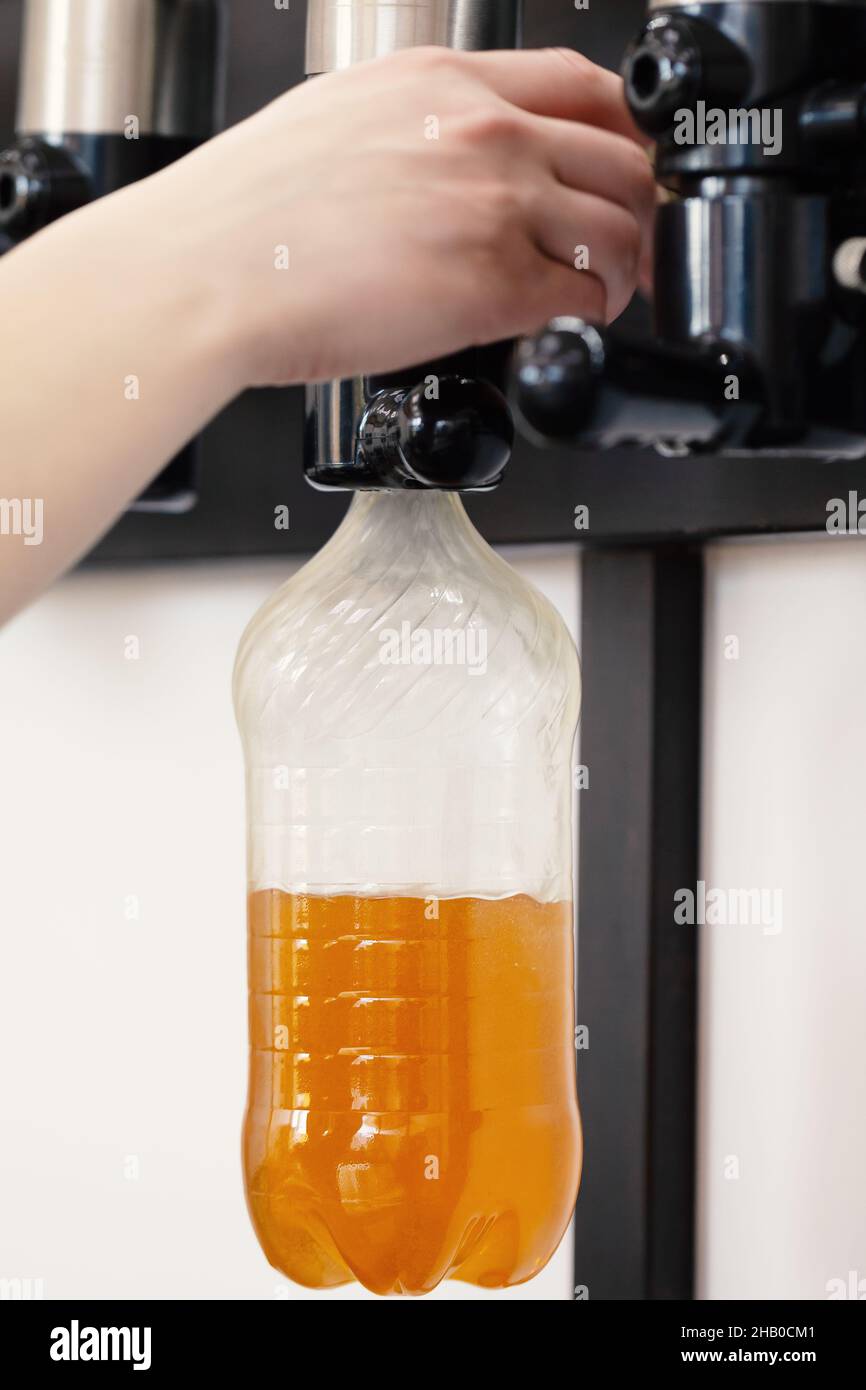New modern beer taps with plastic bottles on bar counter in pub Stock ...