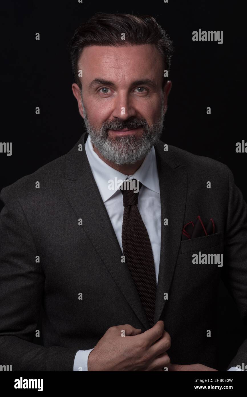 Portrait of a stylish elegant senior businessman with a beard and ...