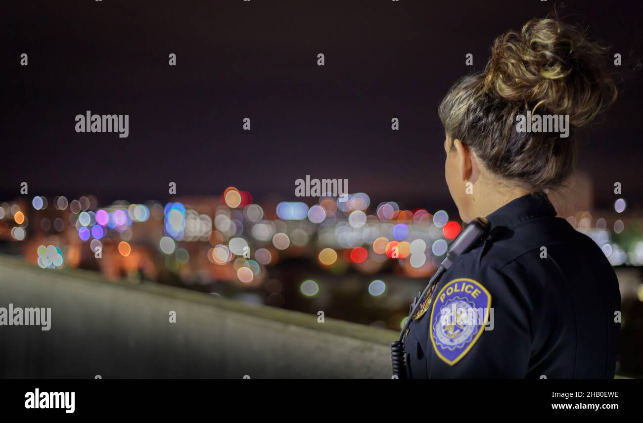 Side view of a female police officer Stock Photo - Alamy