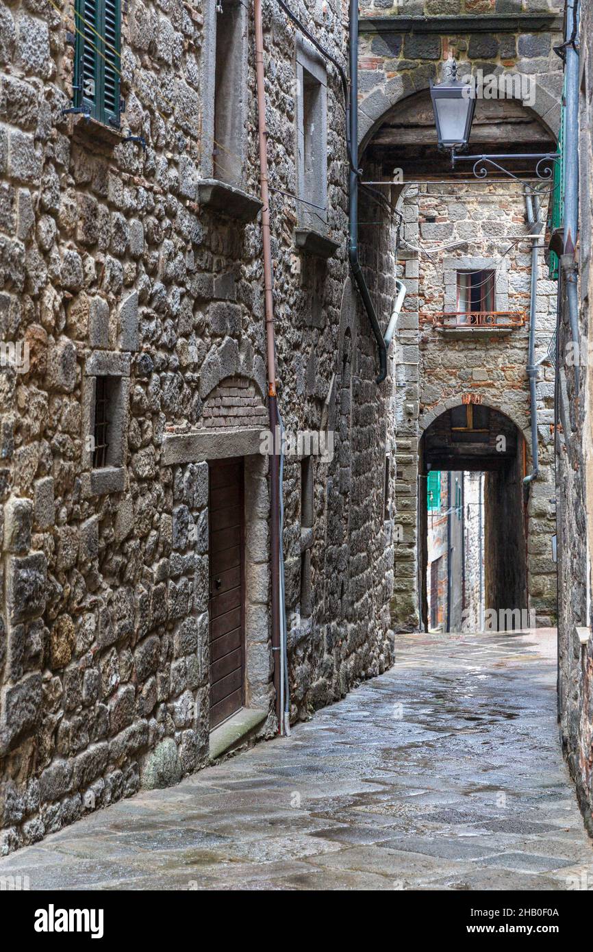 Dark alley in an old Italian city Stock Photo - Alamy