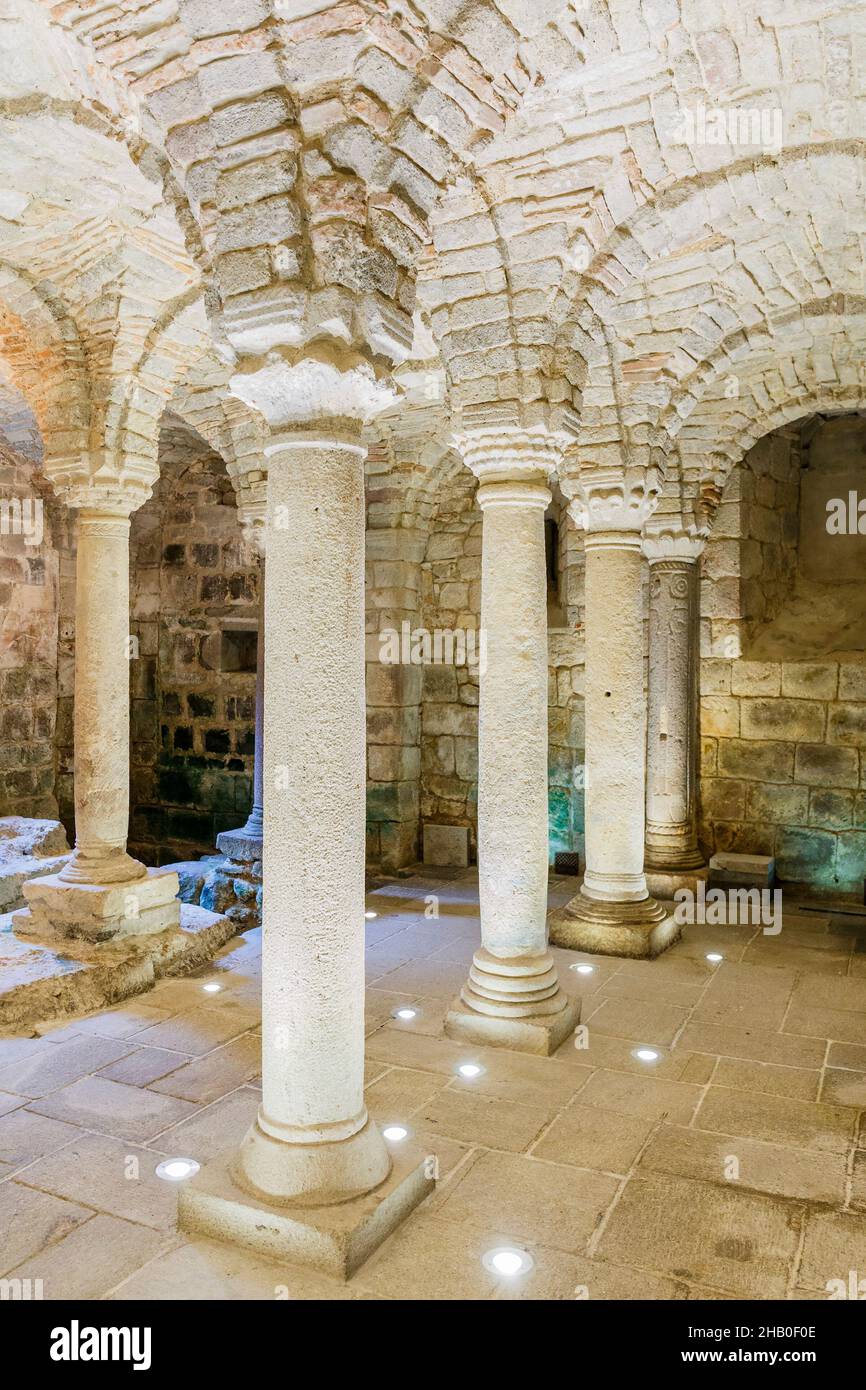 Interior of an old crypt with pillars in the archway Stock Photo - Alamy
