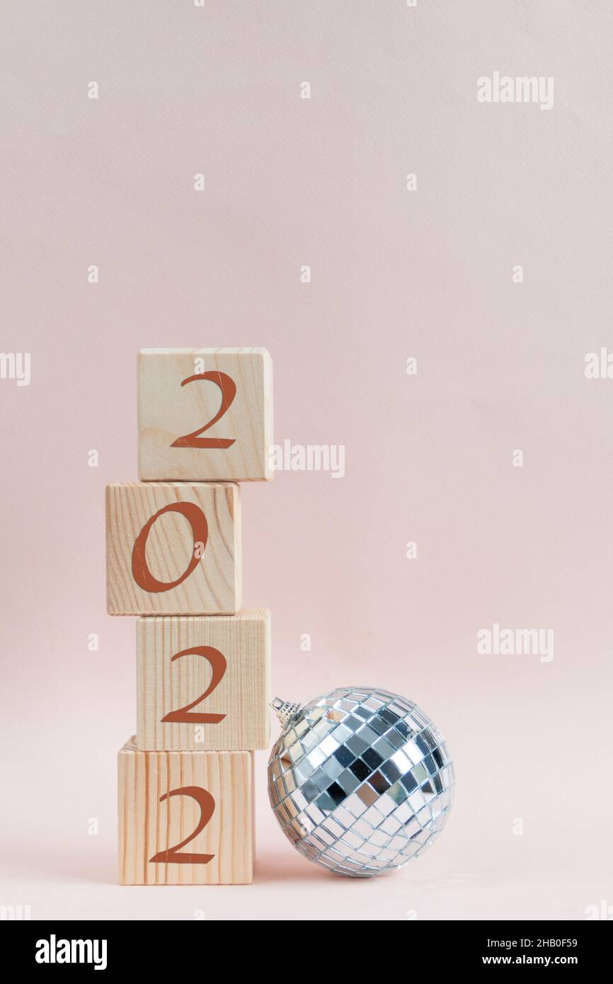 Wooden cubes pyramid with new year numbers and shining disco ball Stock ...