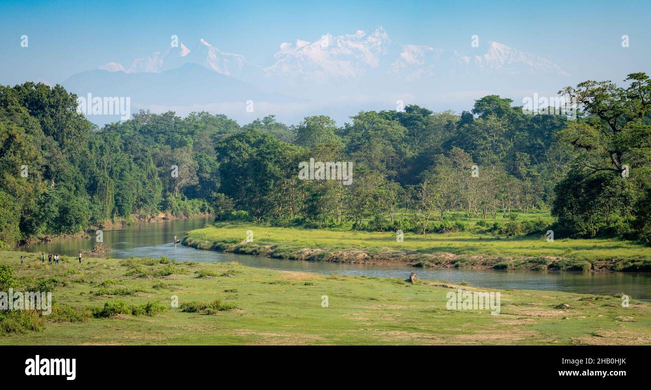 A view of the Rapti River, the Chitwan National Park with the Himalaya ...