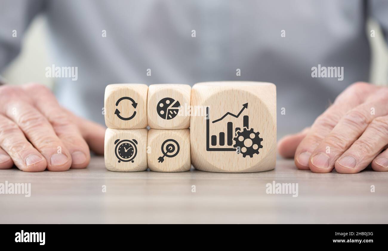 Wooden blocks with symbol of productivity concept Stock Photo - Alamy