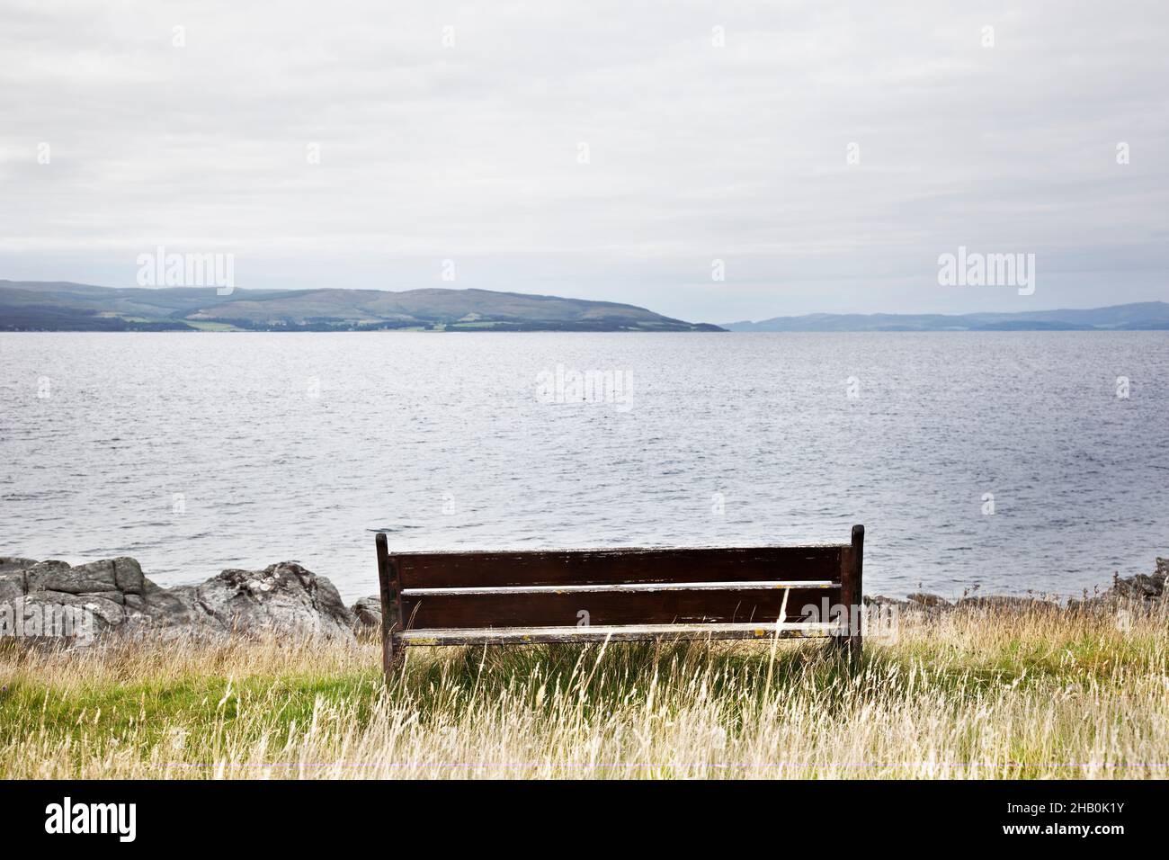 Bench on seaside in Arran Island. Scotland Stock Photo - Alamy