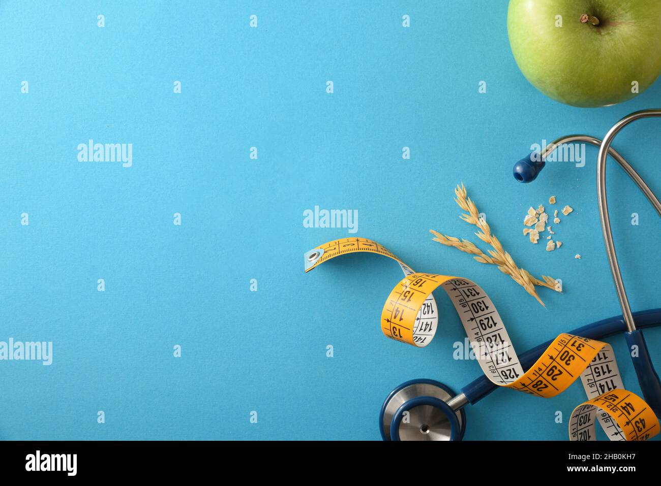 Nutritional medical health background with stethoscope tape measure ...