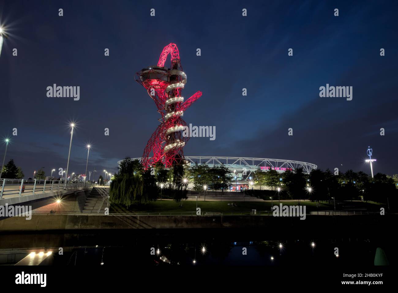 Night view of the illuminated Olympic stadium and ArcelorMittal Orbit ...