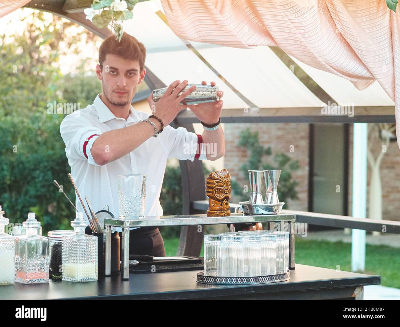 Young bartender cocktail shaking drinks hi-res stock photography and ...