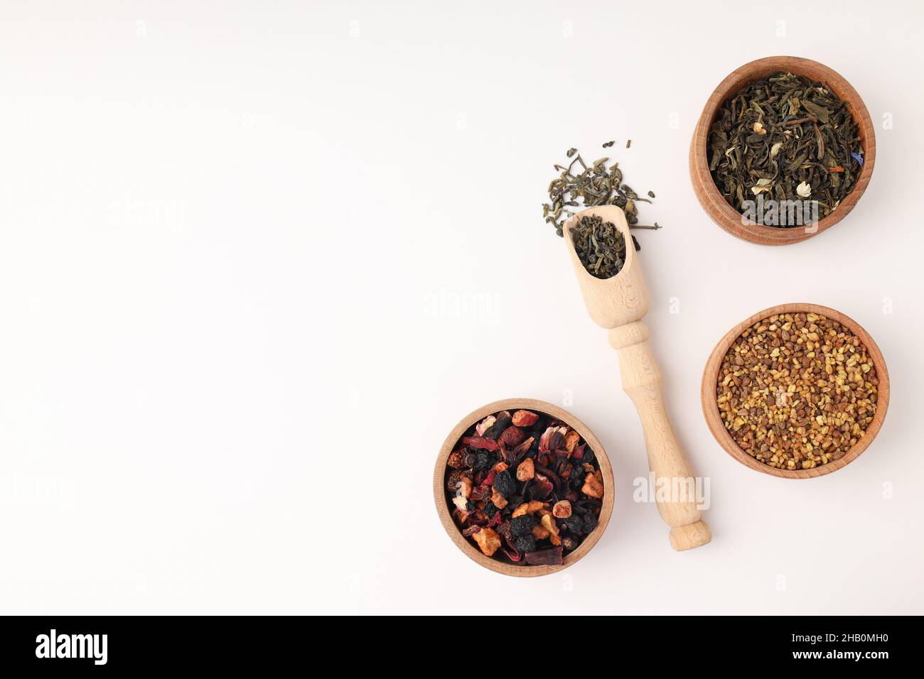 Concept of cooking tea with different types of tea on white background ...