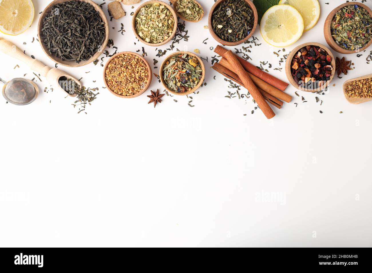 Concept of cooking tea with different types of tea on white background ...