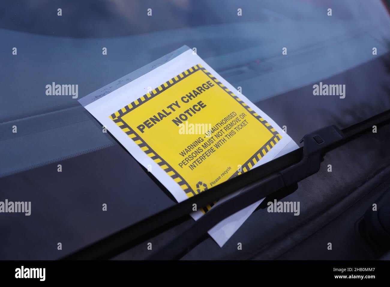 A parking ticket / penalty charge notice pictured on a car in ...