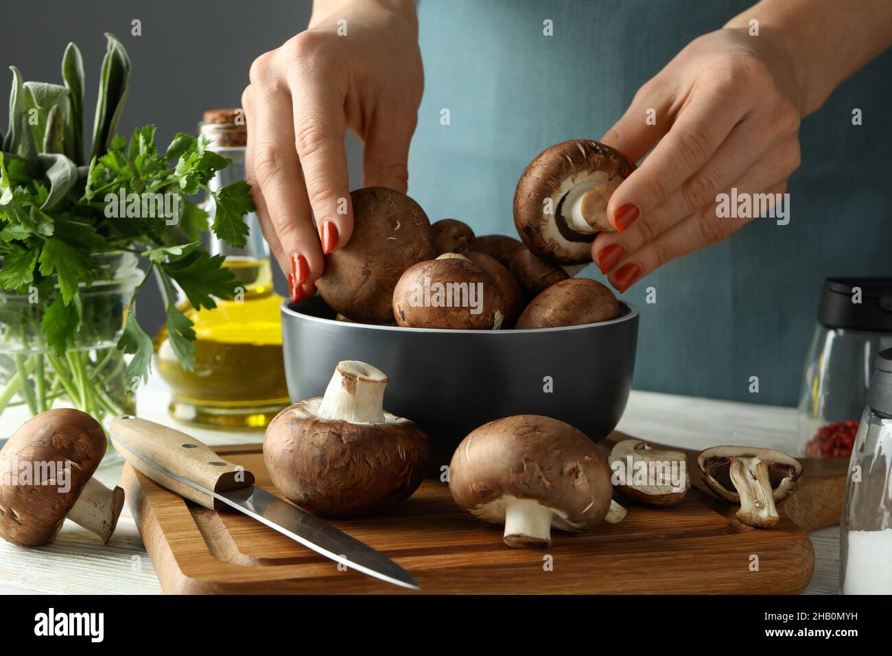 Concept of cooking with champignon on white wooden table Stock Photo ...