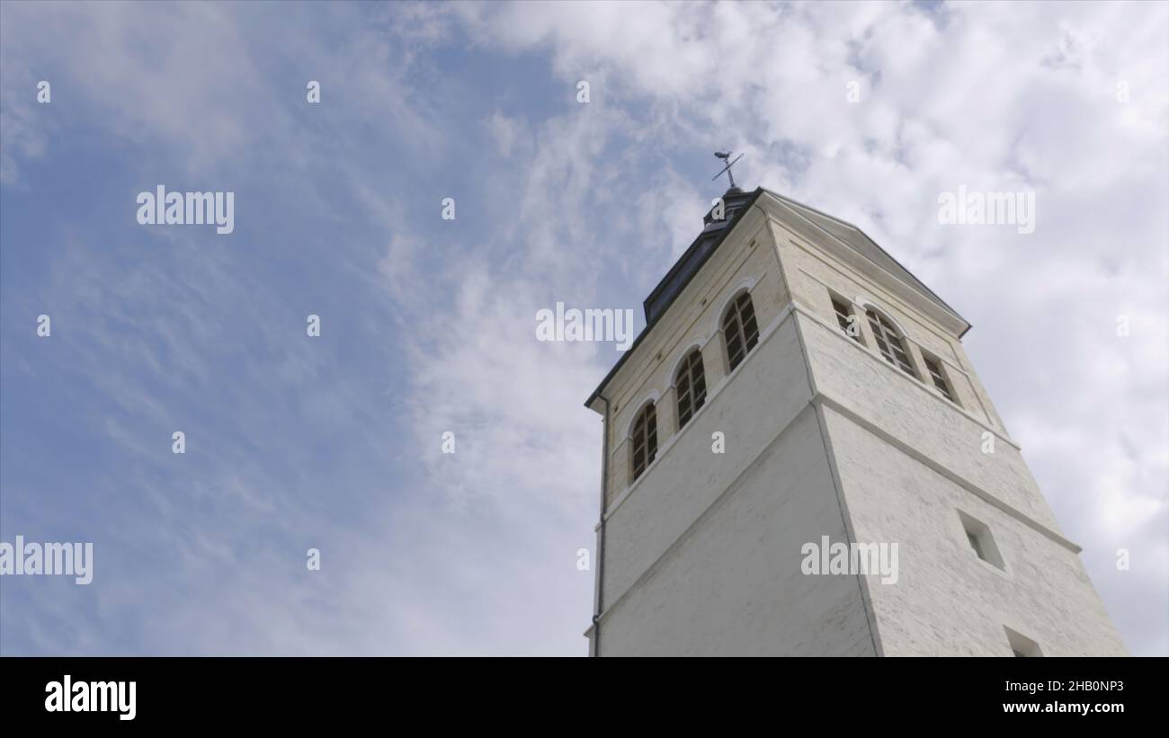 Church tower on a sunny day. Action. White Church steeple on background ...
