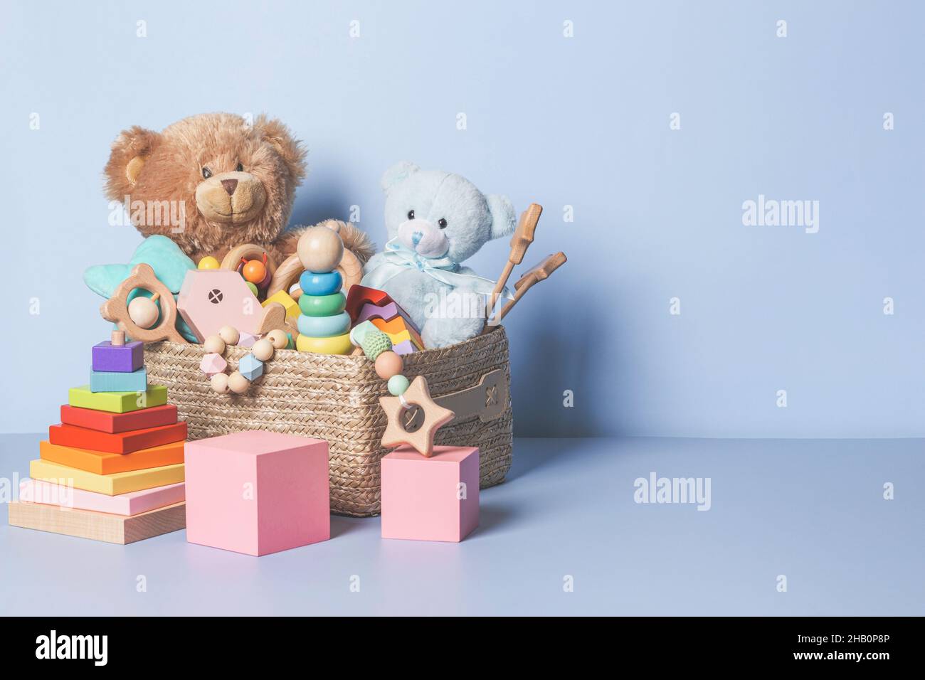 Toy box full of baby kid toys. Container with teddy bear, wooden ...