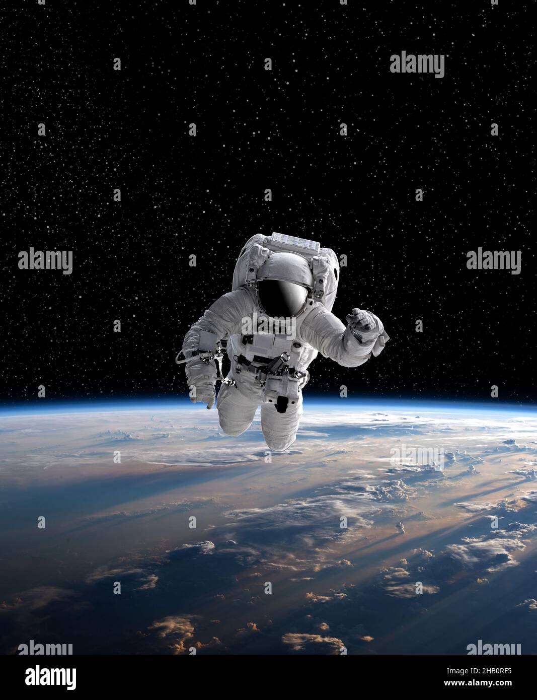 Astronaut in outer open space over the planet Earth.Stars provide ...