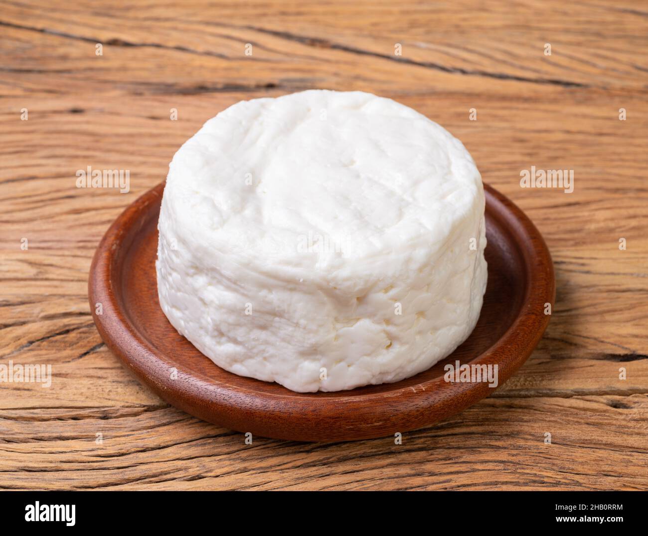 Frescal cheese, typical brazilian fresh white cheese over wooden table ...